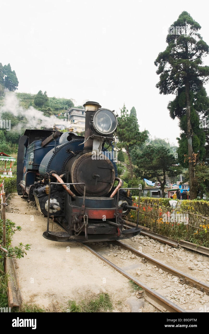 Steam train on railroad tracks, Darjeeling Himalayan Railway ...