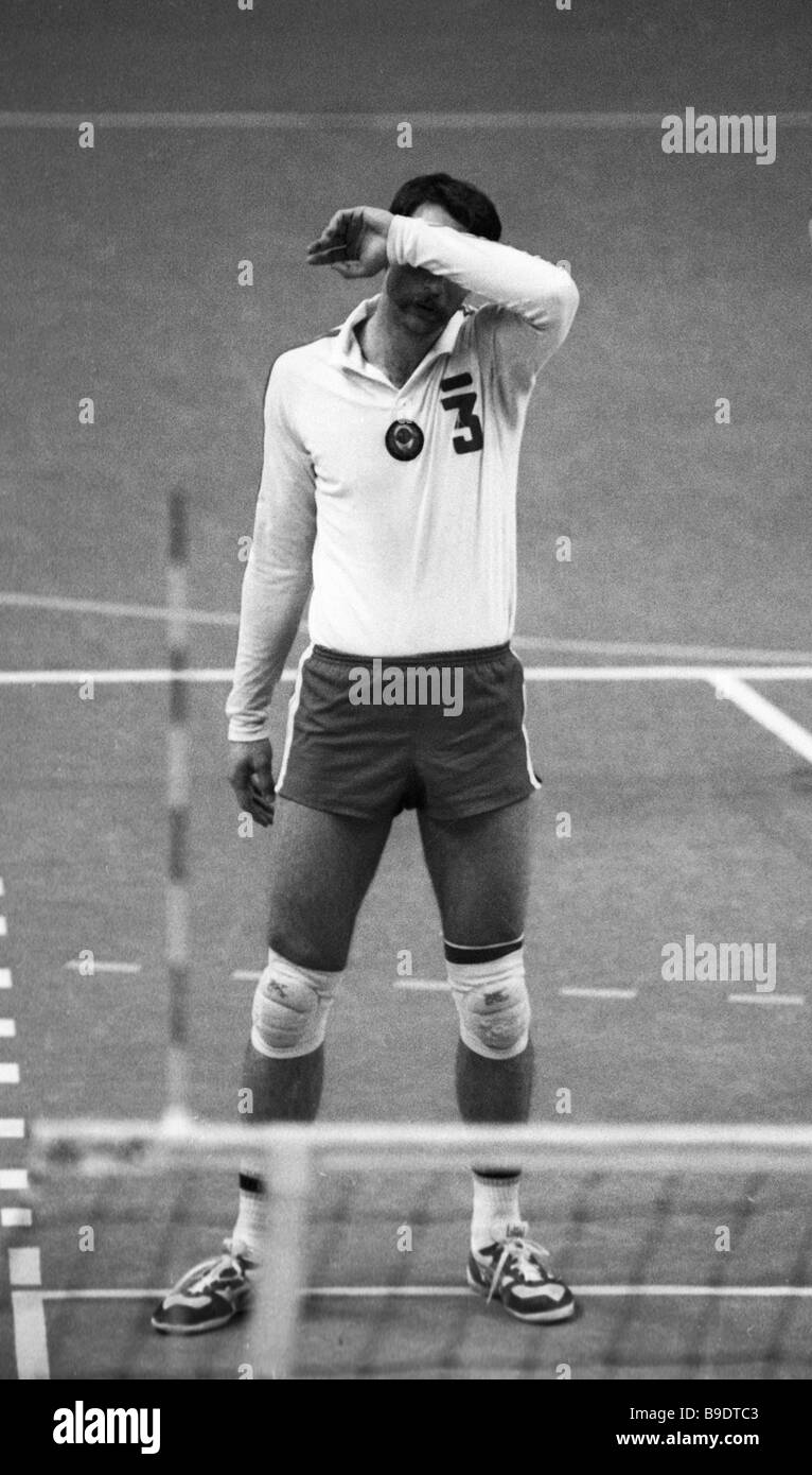 CSKA volley ball team spiker Alexander Savin wipes sweat from his face ...