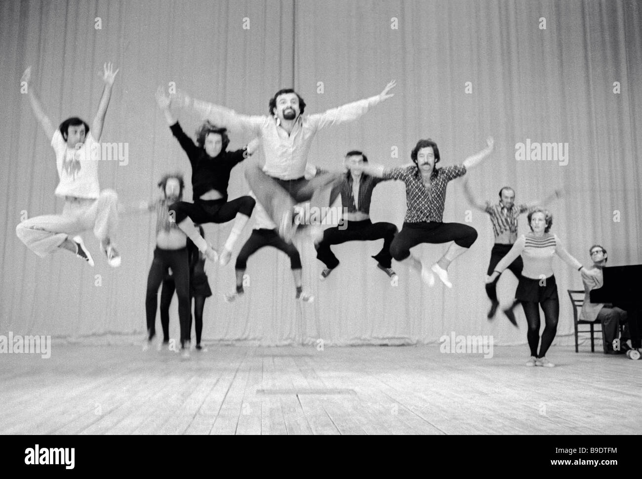 Actors of the Chamber musical Jewish theatre practicing in dance room ...