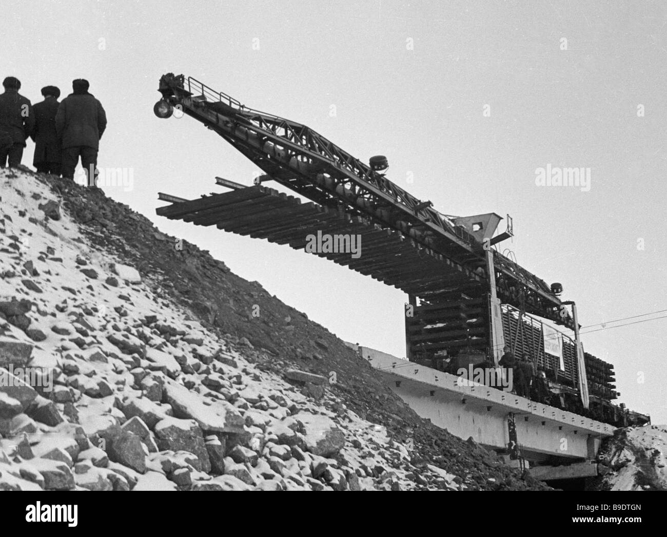 A track laying vehicle passes the last bridge of the Small BAM Baikal ...