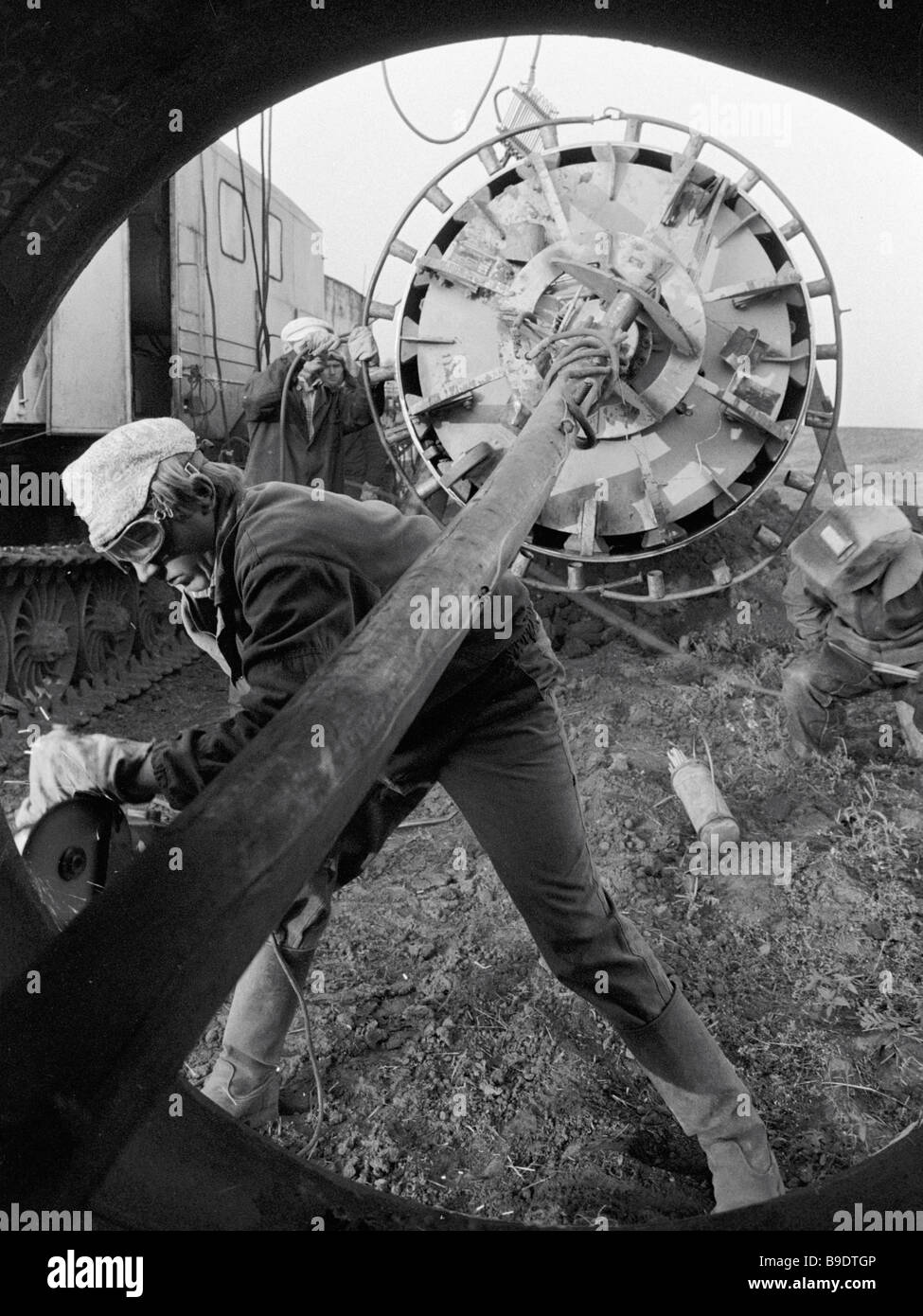 Fitter Alexander Vorobyov preparing pipes for welding Stock Photo - Alamy