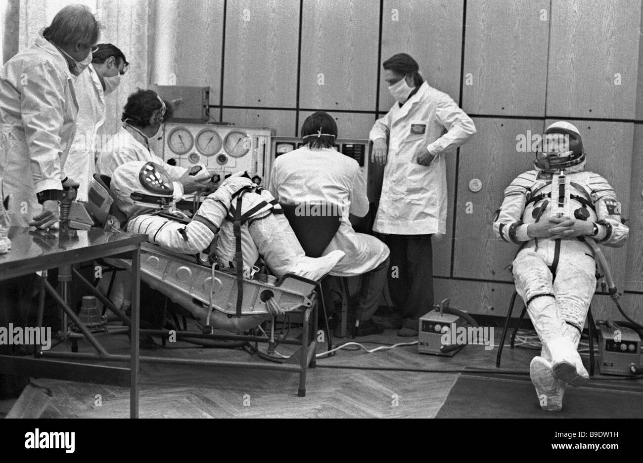 Cosmonaut Valery Ryumin right checks space suit before entering Soyuz ...