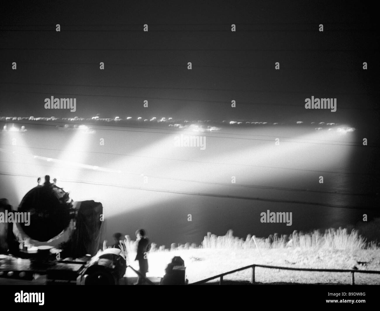 The city harbor lit by a spotlight at night Stock Photo - Alamy