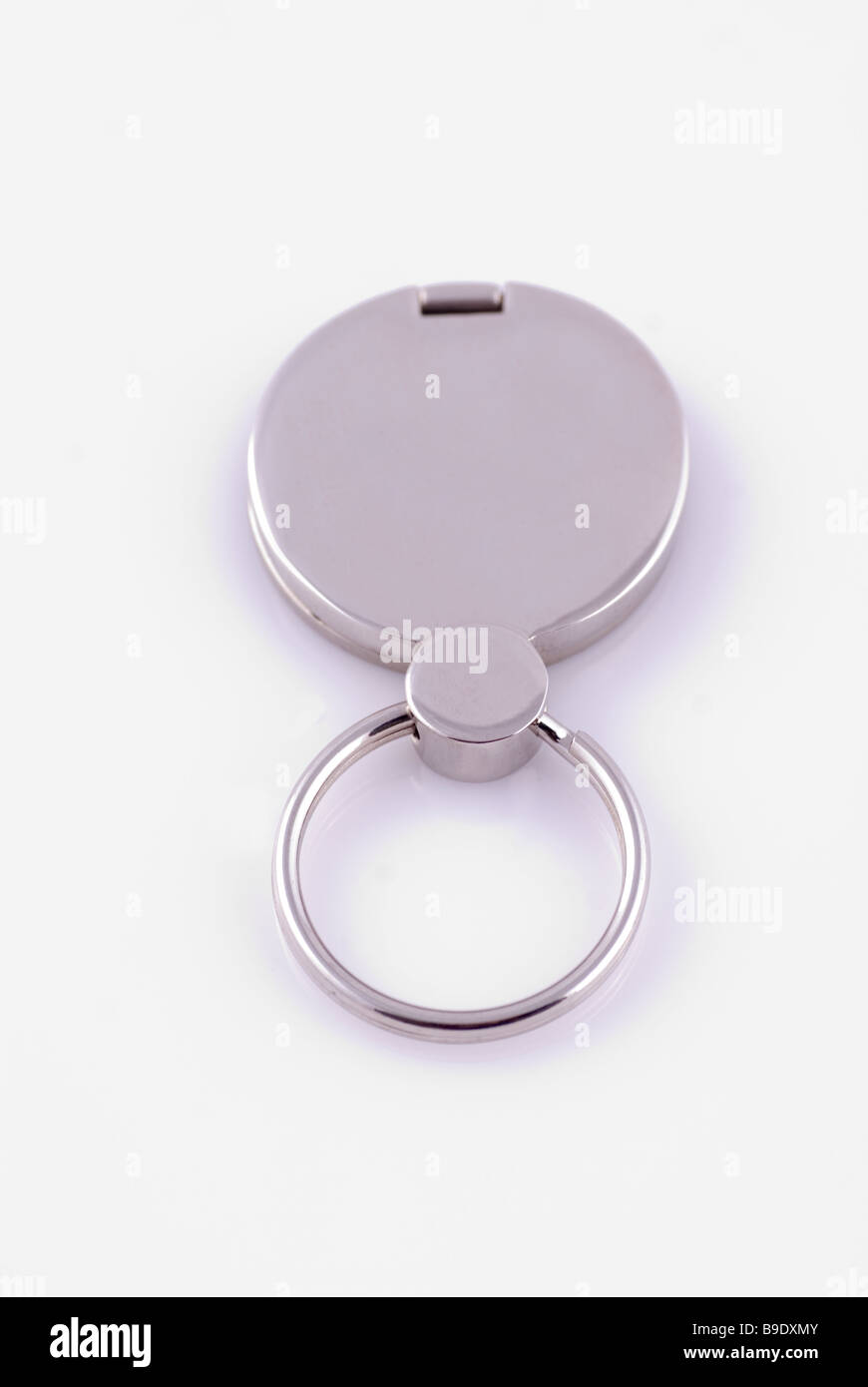 Silver key chain isolated against a white background Stock Photo - Alamy