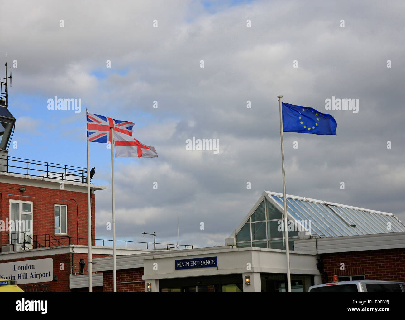 Flags flying at an airport Stock Photo - Alamy