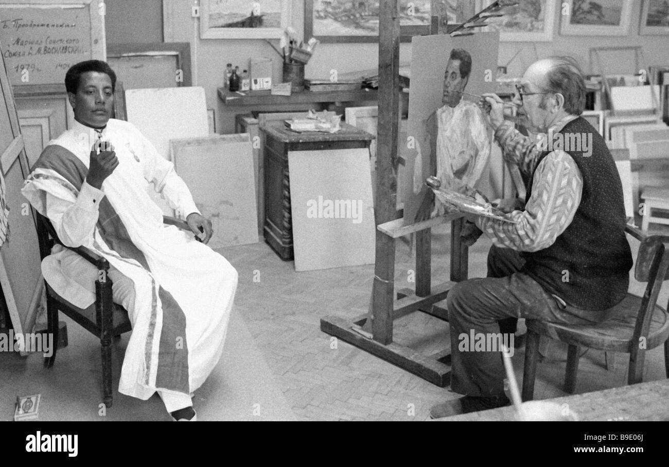 Renowned Ethiopian artist Afwerk Tekle left sits for a portrait made by ...
