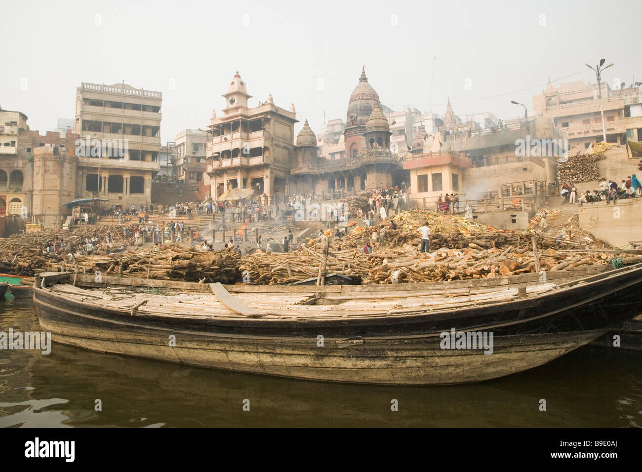 Firewood on the boats with cremation of dead bodies at a ghat ...
