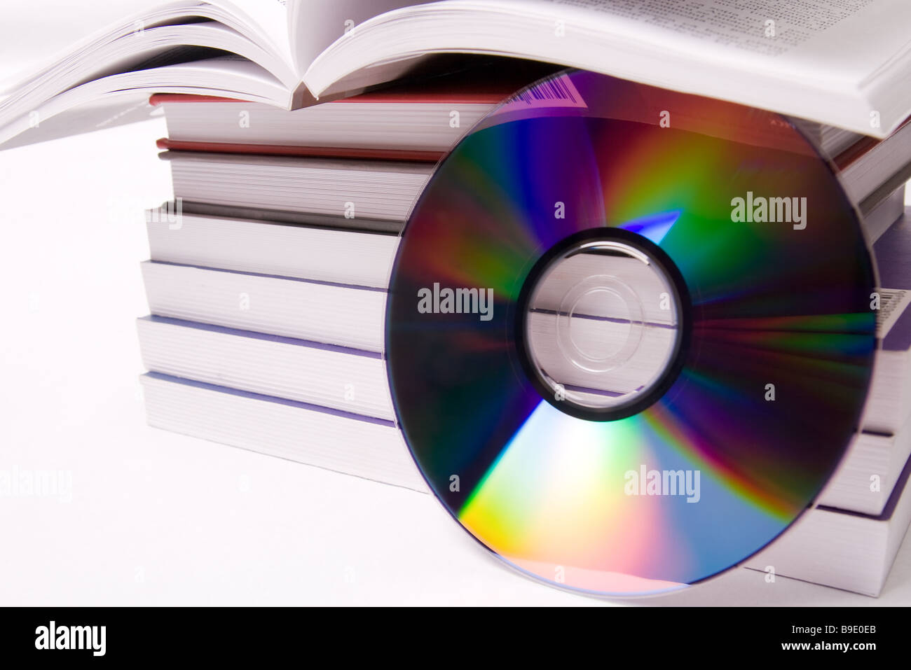 Audio book concept pile of books and one cd over white Stock Photo - Alamy