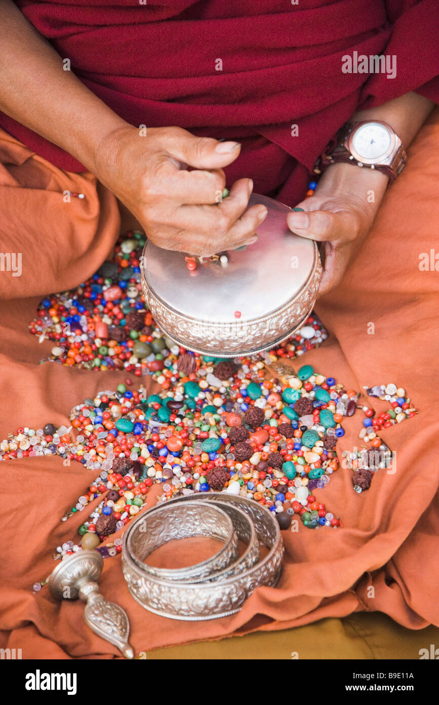 Monk arranging religious objects, Mahabodhi Temple, Bodhgaya, Gaya ...