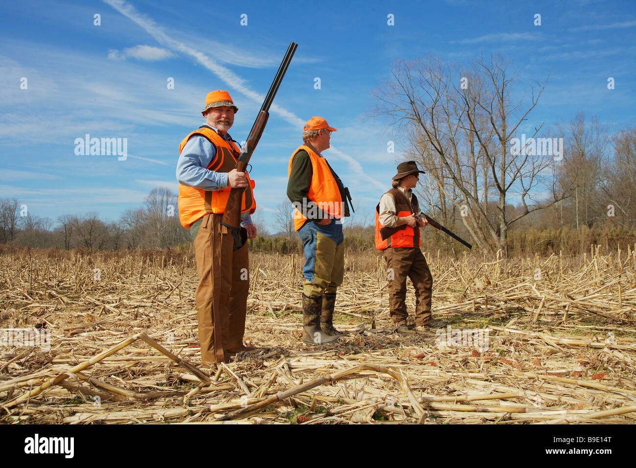 FULL LENGTH VIEW TWO HUNTERS AND GUIDE SEARCHING HORIZON FOR GAME ...