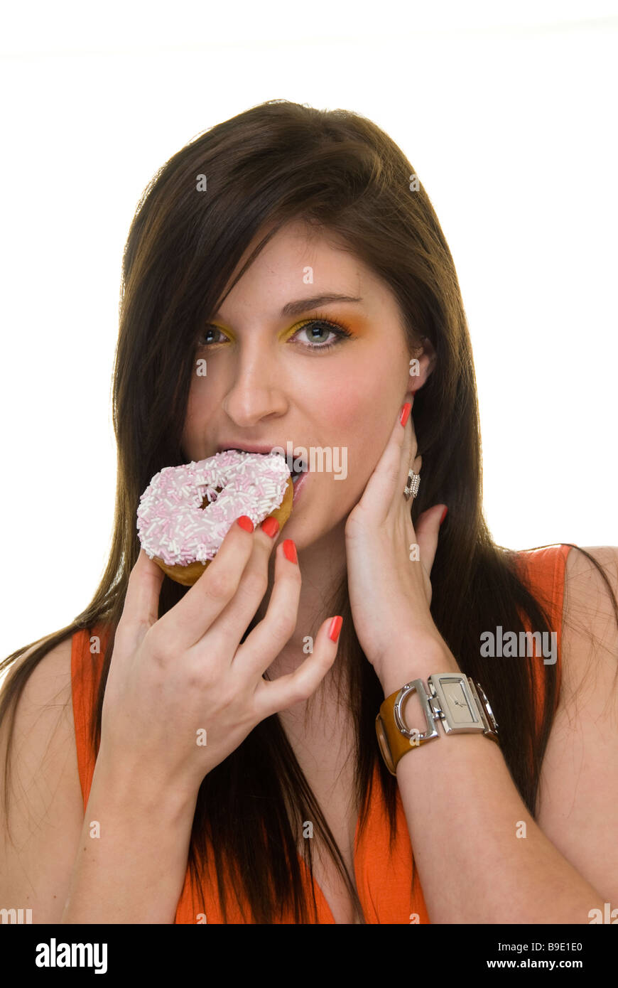 woman eating a donut Stock Photo - Alamy
