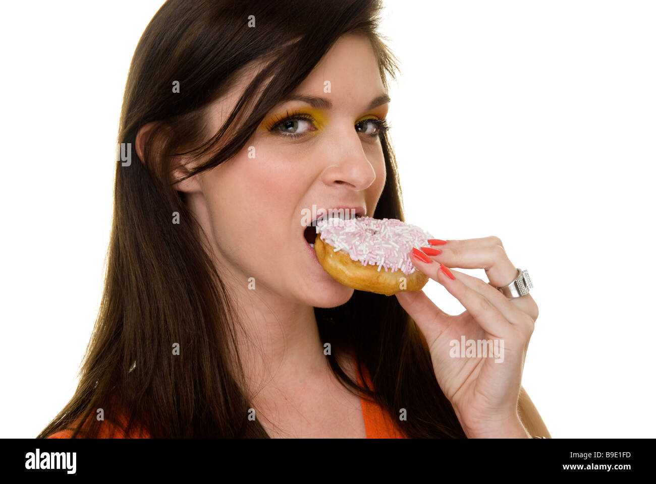 woman eating a donut Stock Photo - Alamy