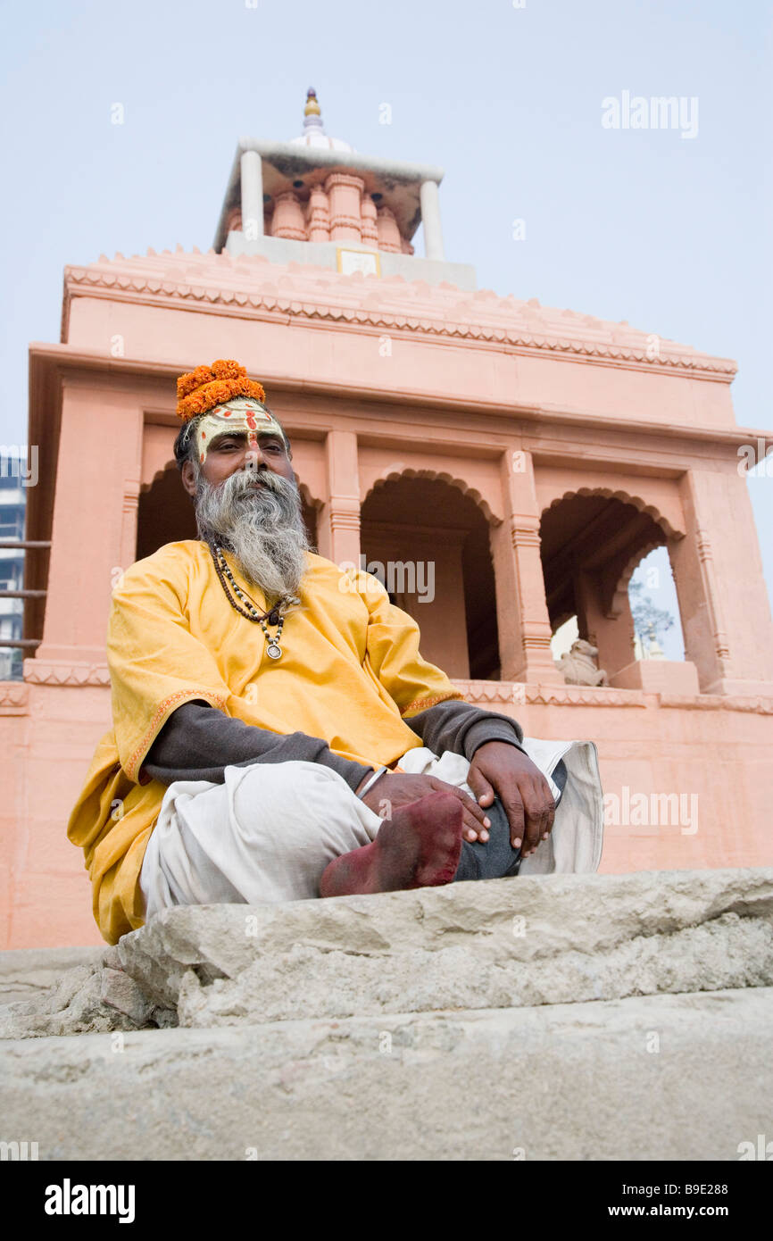 Sadhu sitting and praying in front of a temple, Varanasi, Uttar Pradesh ...
