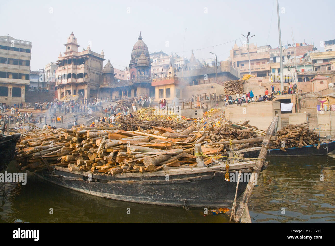 Firewood on the boats with cremation of dead bodies at a ghat ...