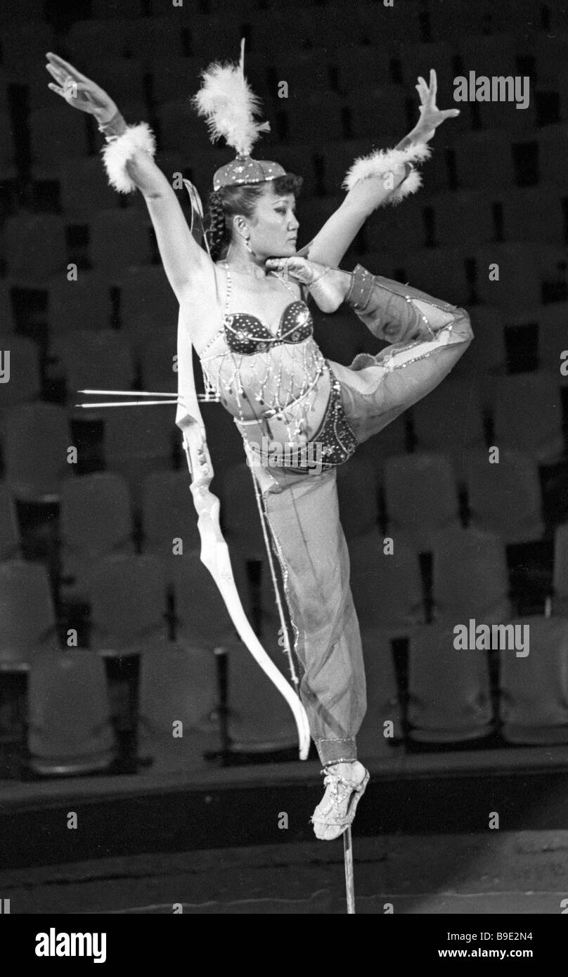A Kyrgyz circus acrobat with her number A No Ordinary Archer Stock ...