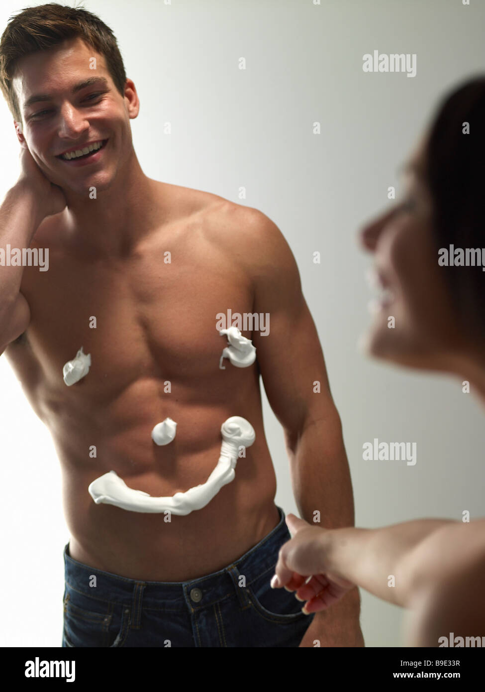 Man with shaving foam smile on body Stock Photo - Alamy