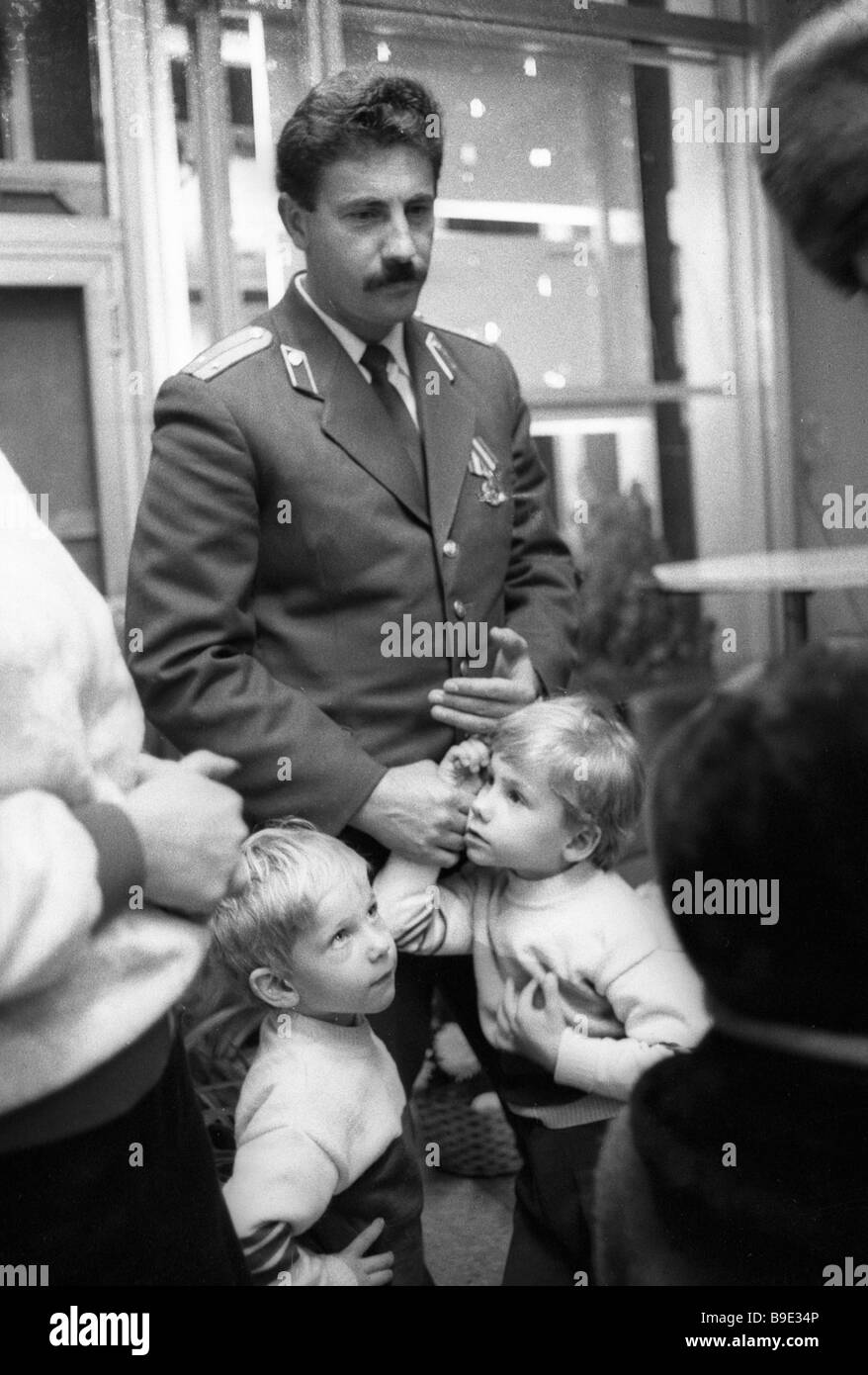 Police lieutenant Pazin with children Stock Photo - Alamy