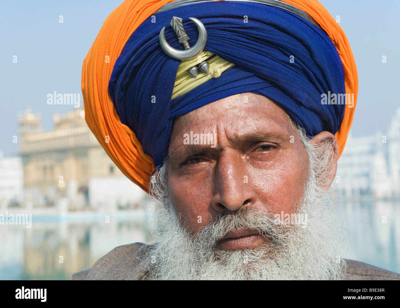 Portrait of a Sikh man with a temple in the background, Golden Temple ...