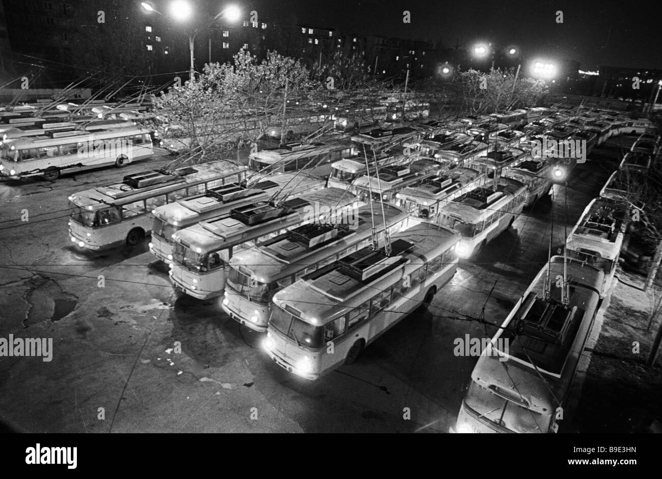 Trolley bus depot at night Stock Photo - Alamy