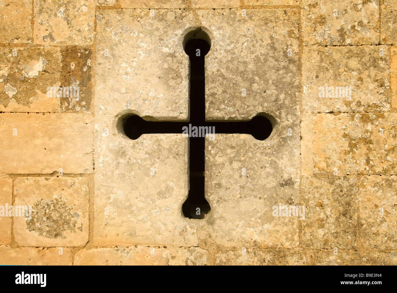 cross cut into stonework on Titchfield Abbey Stock Photo - Alamy