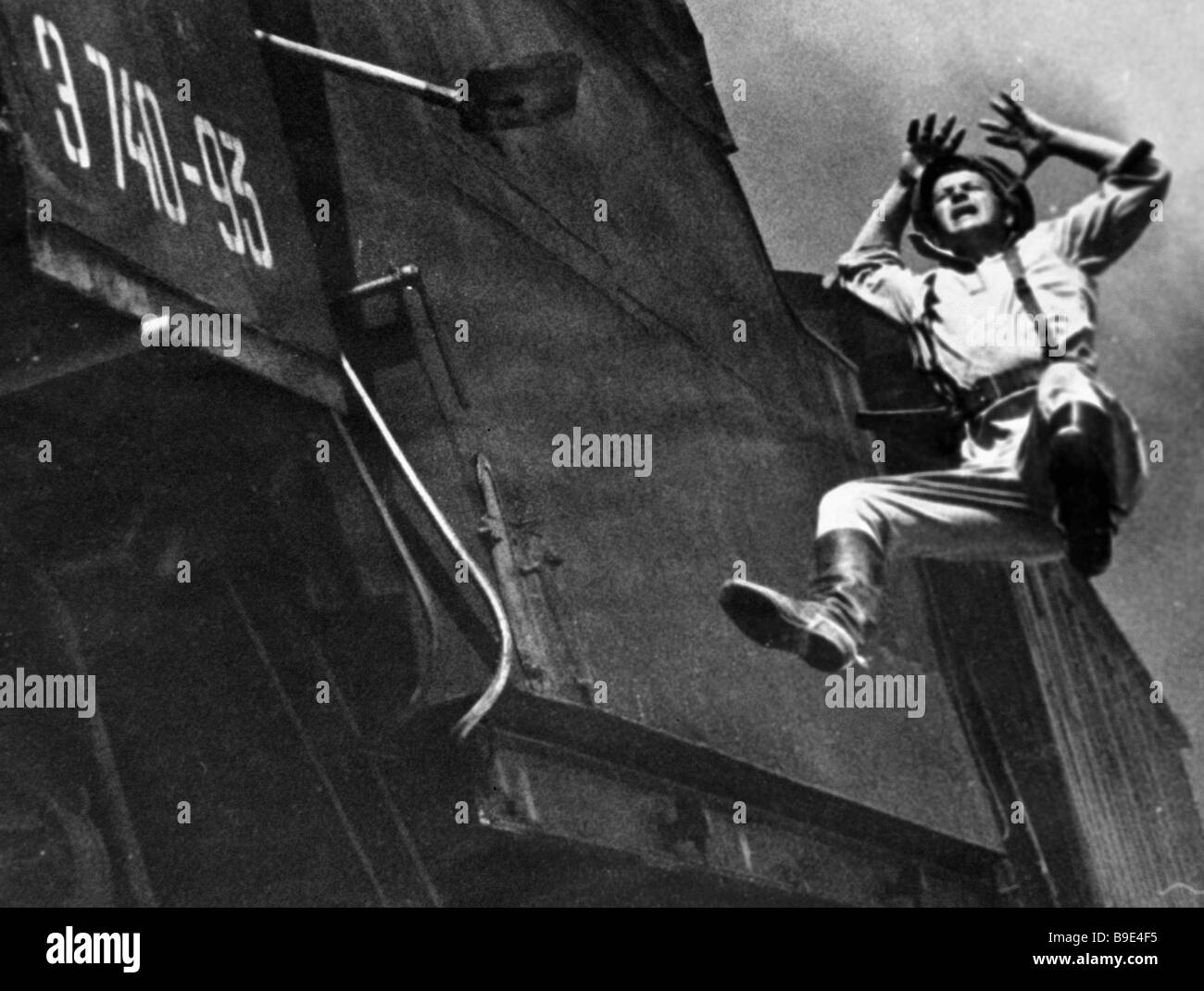 A stunt jumping from the burning train Stock Photo - Alamy