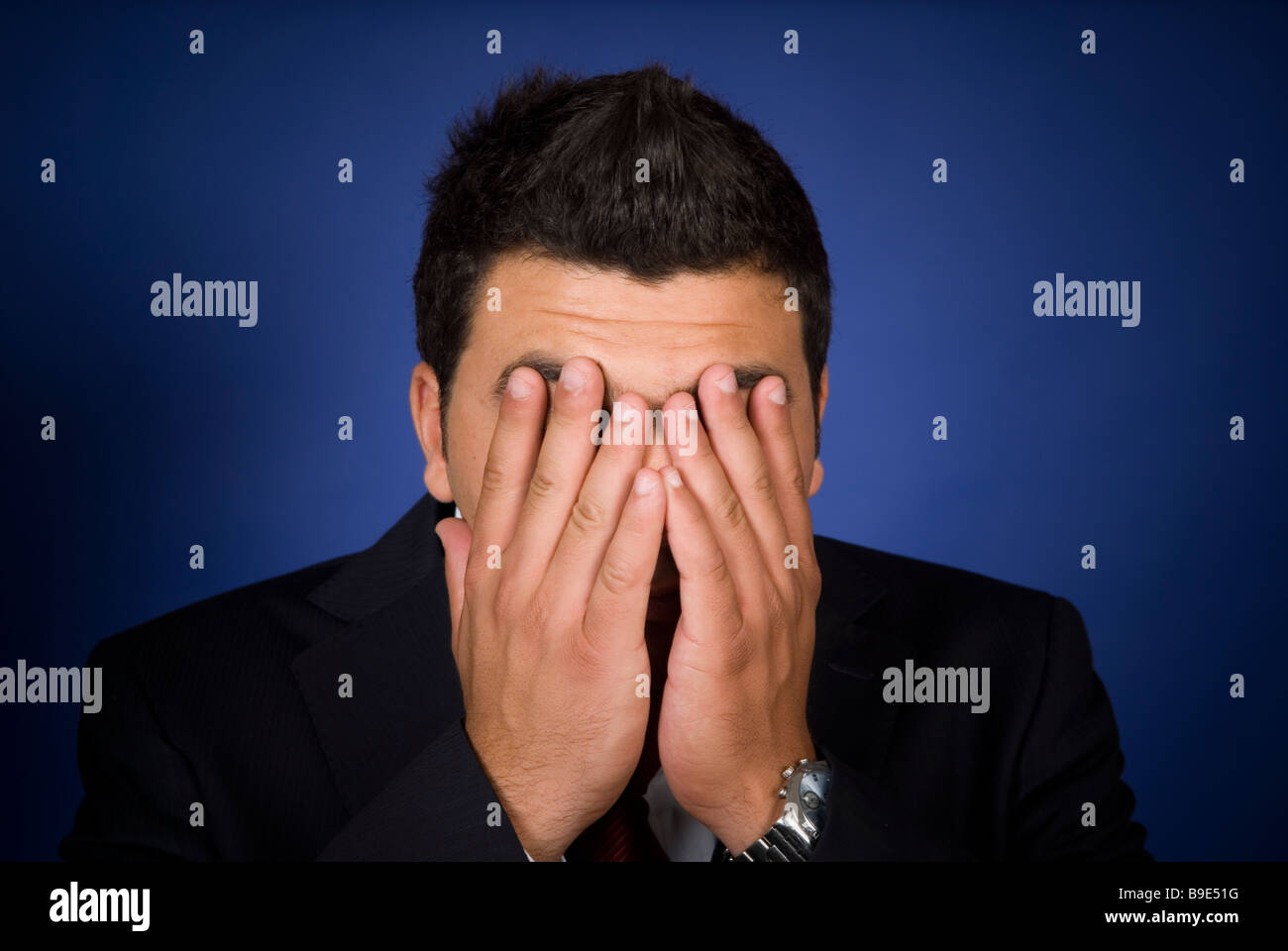 Business man head in hands Stock Photo - Alamy