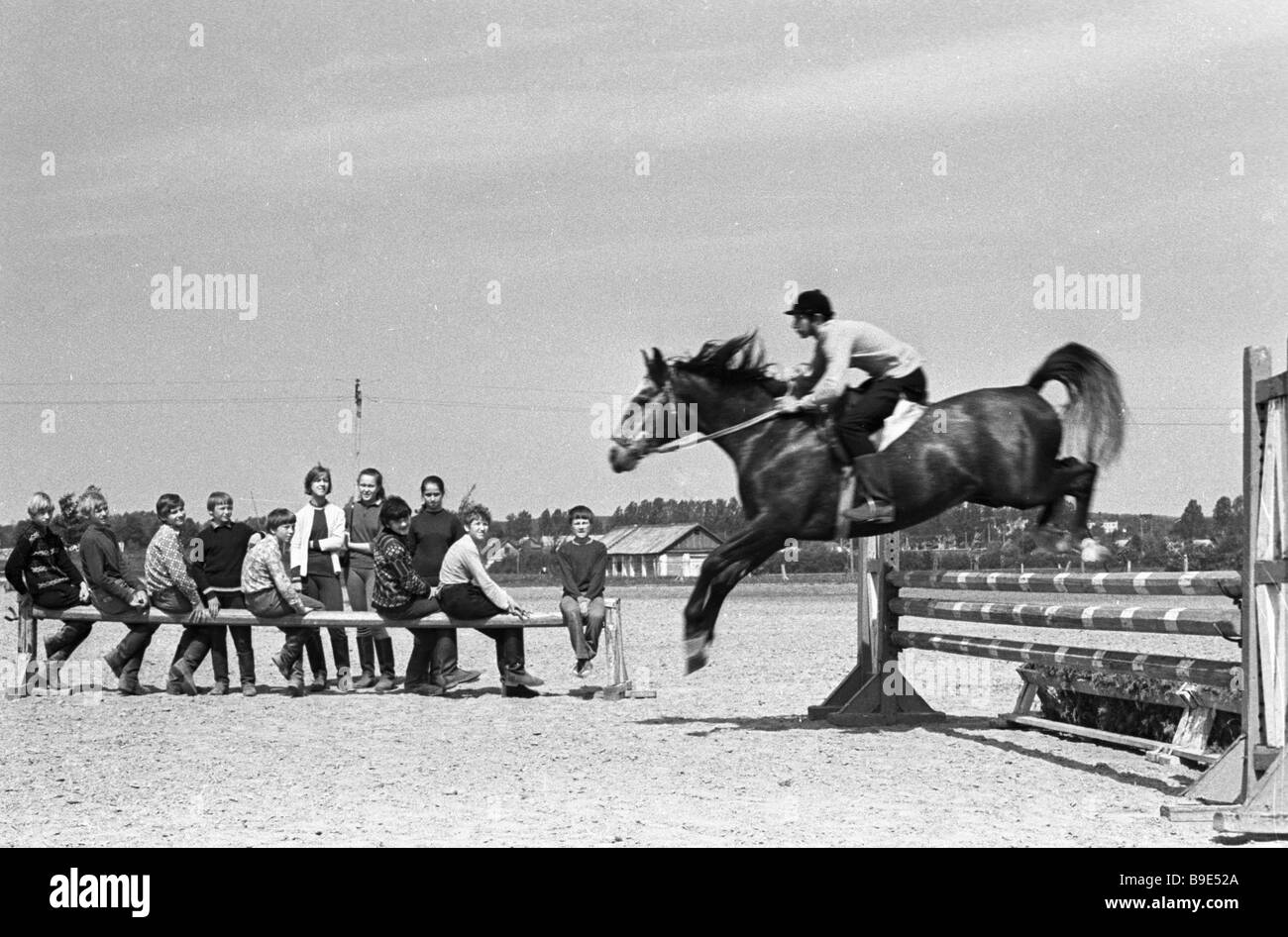 Show jumping lesson at a riding school for children in the village of ...