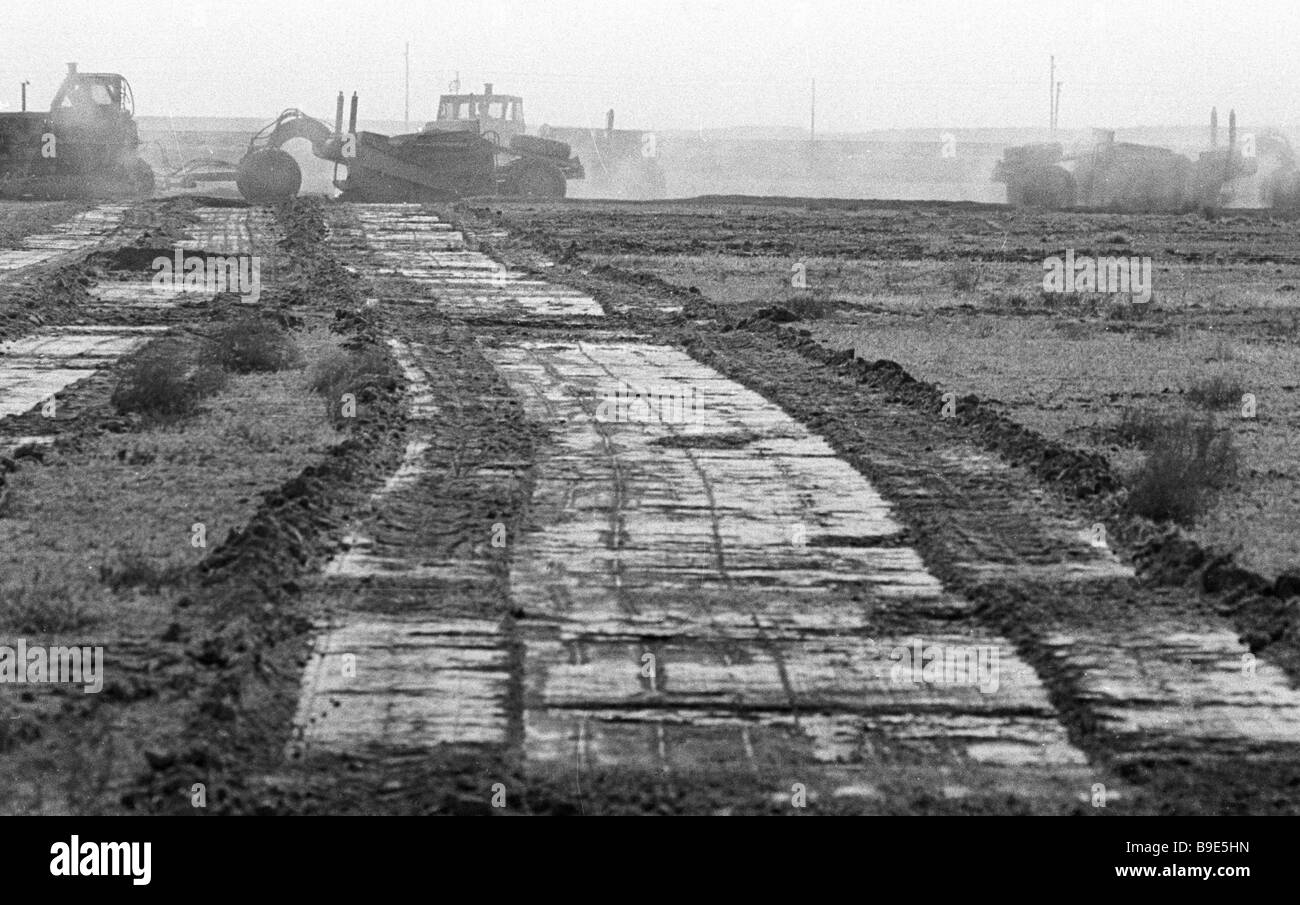 Land grading for growing rice in the Karshi steppe Stock Photo - Alamy