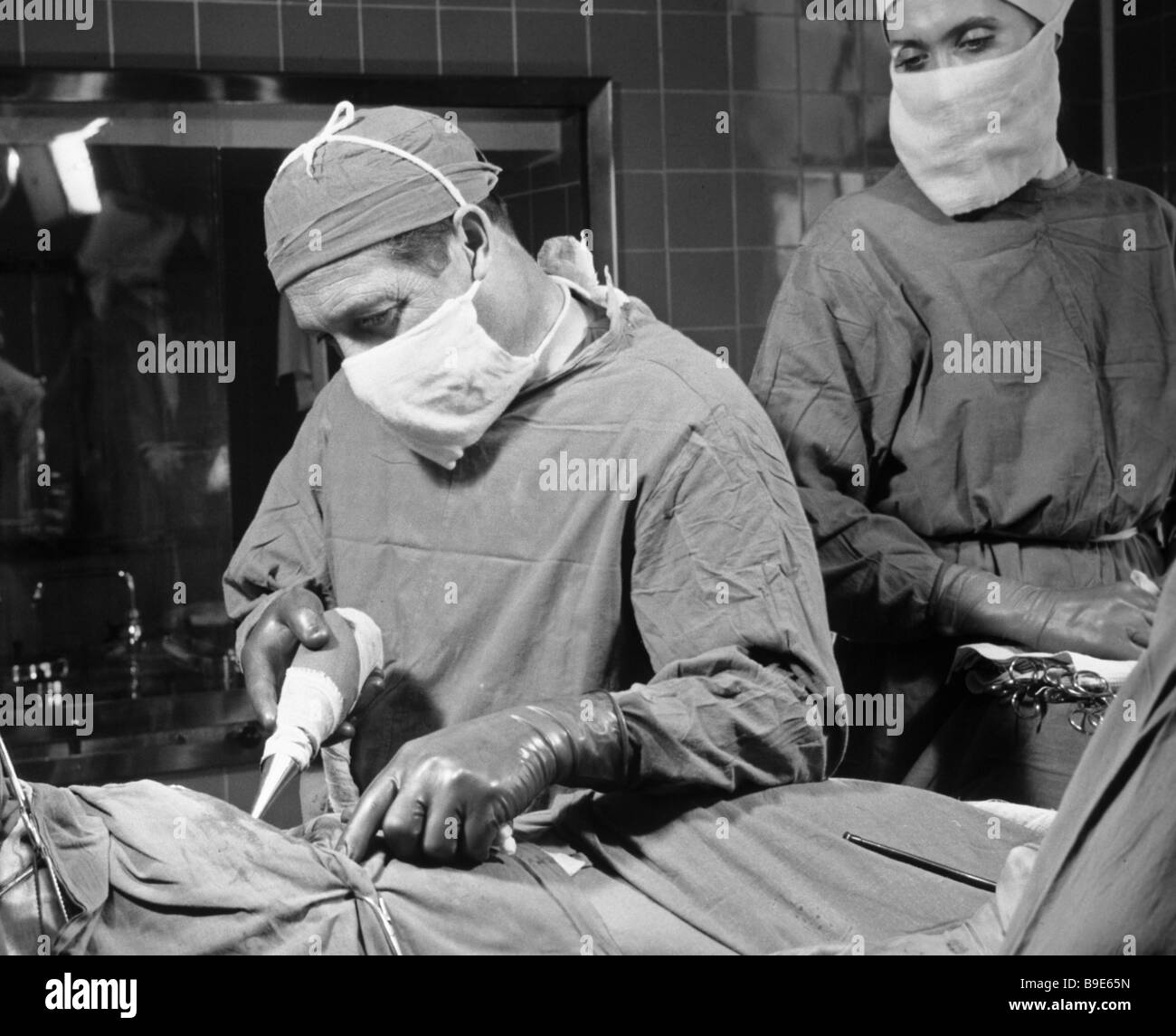 A surgeon performs a surgery using an US scalpel Research Institute of ...