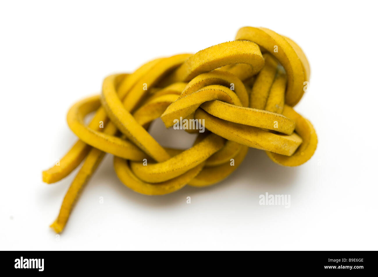 Tangled Rubber band on a white background Stock Photo - Alamy