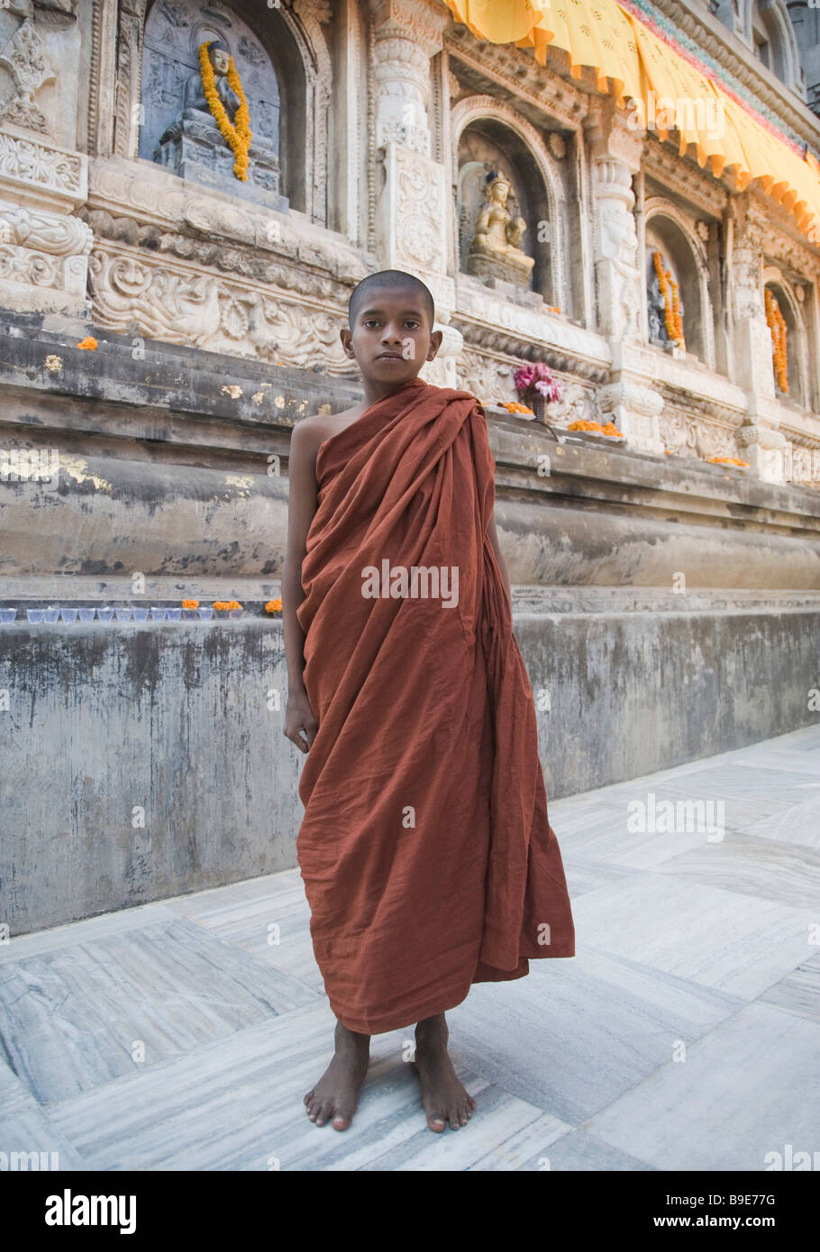 Monk standing in a temple, Mahabodhi Temple, Bodhgaya, Gaya, Bihar ...