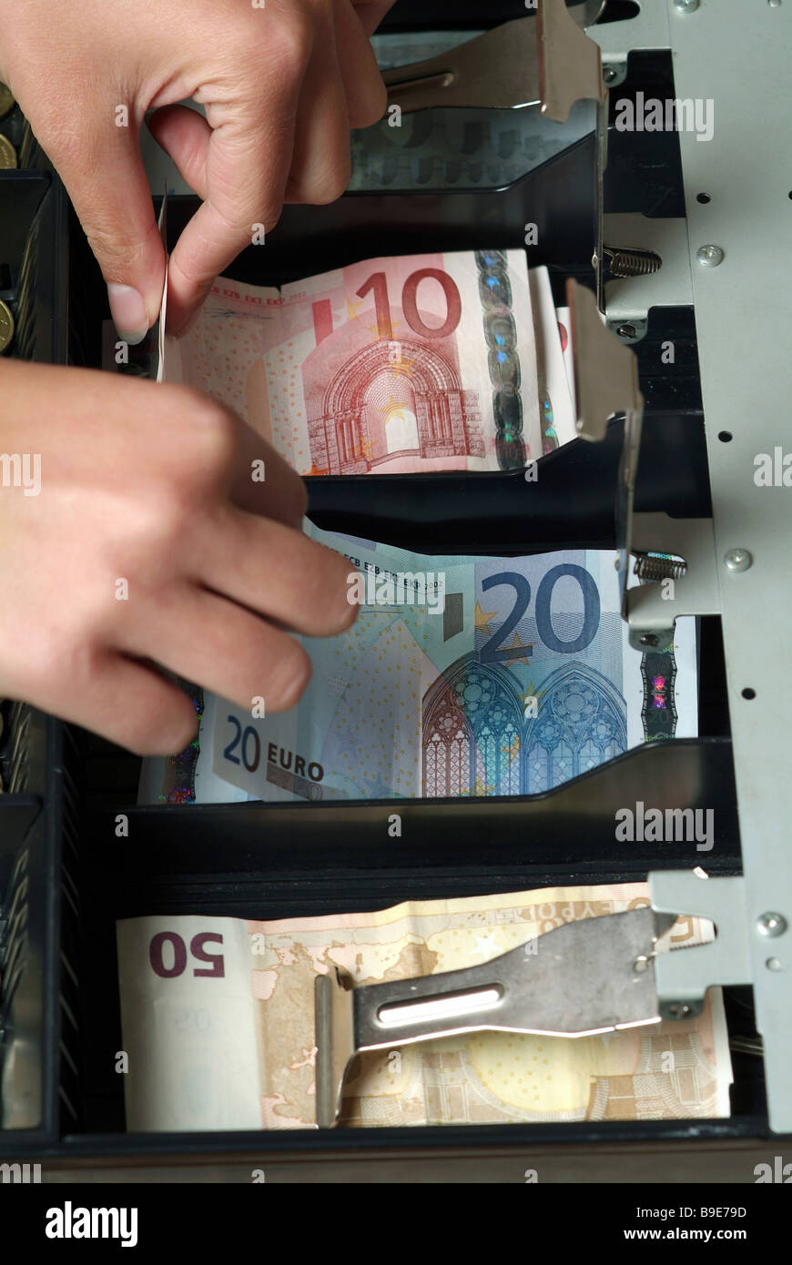 Cash register with money Stock Photo - Alamy