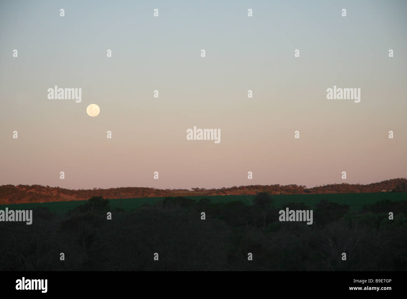 Moon rising over the hills Stock Photo - Alamy