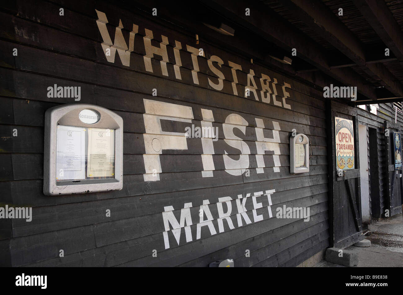 whitstable fish market painted sign on the shutter boarded exterior ...