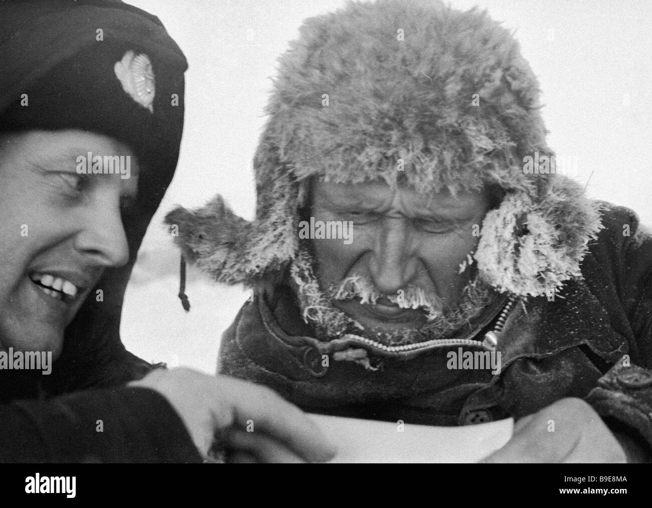 Polar explorer right reads correspondence that was delivered by plane ...