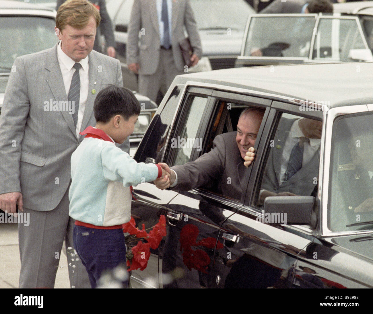 Soviet leader Mikhail Gorbachev greeting a Chinese school student ...