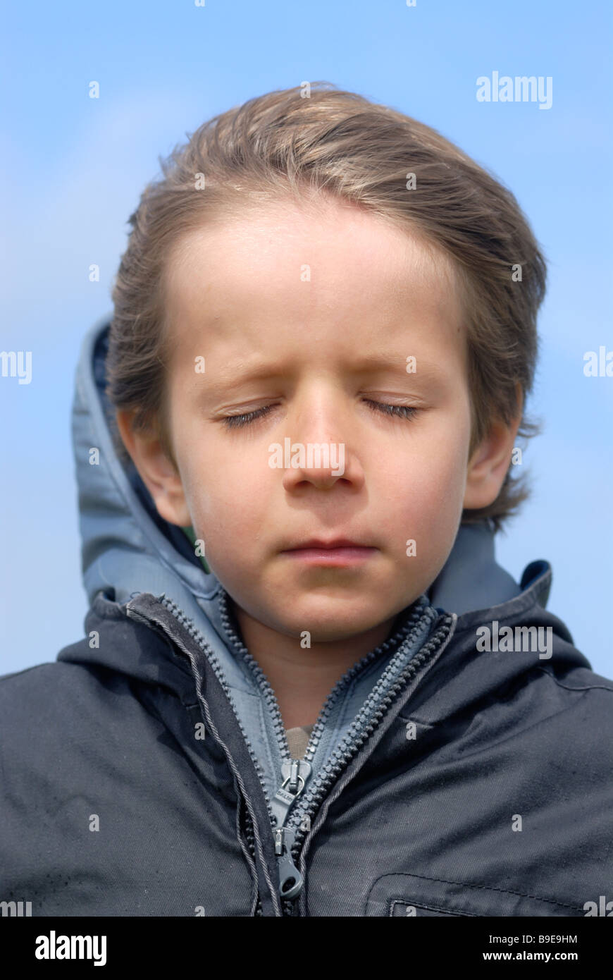 child with eyes shut in the wind Stock Photo - Alamy