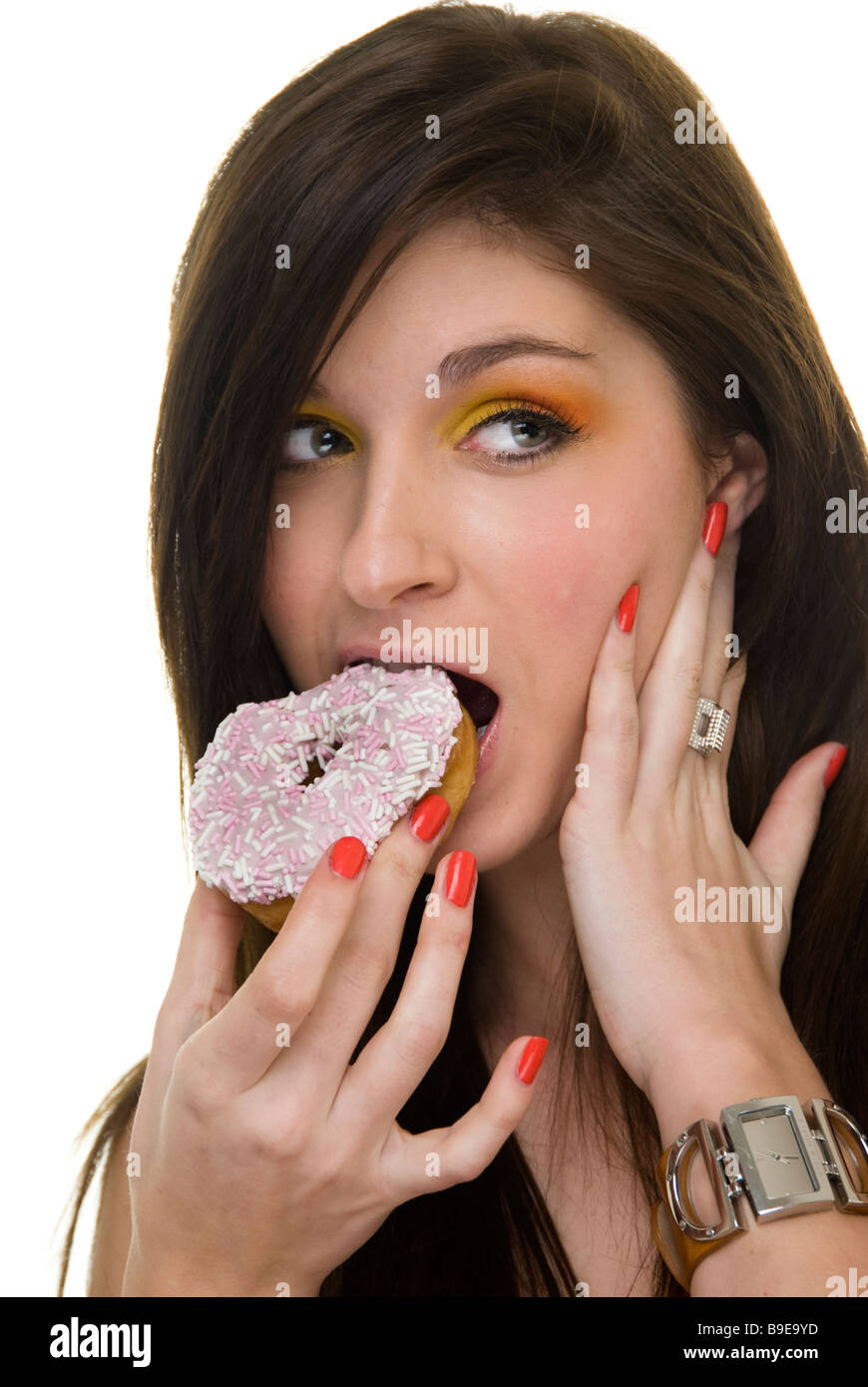 woman eating a donut Stock Photo - Alamy