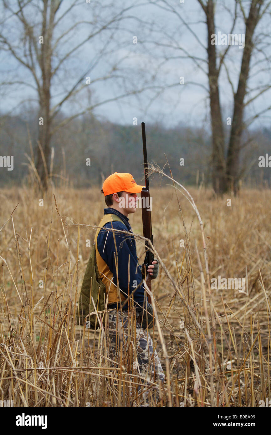 CLOSE UP YOUTH HUNTER IN FIELD REMINGTON SHOTGUN 14 Y O REDHEAD HAT ...