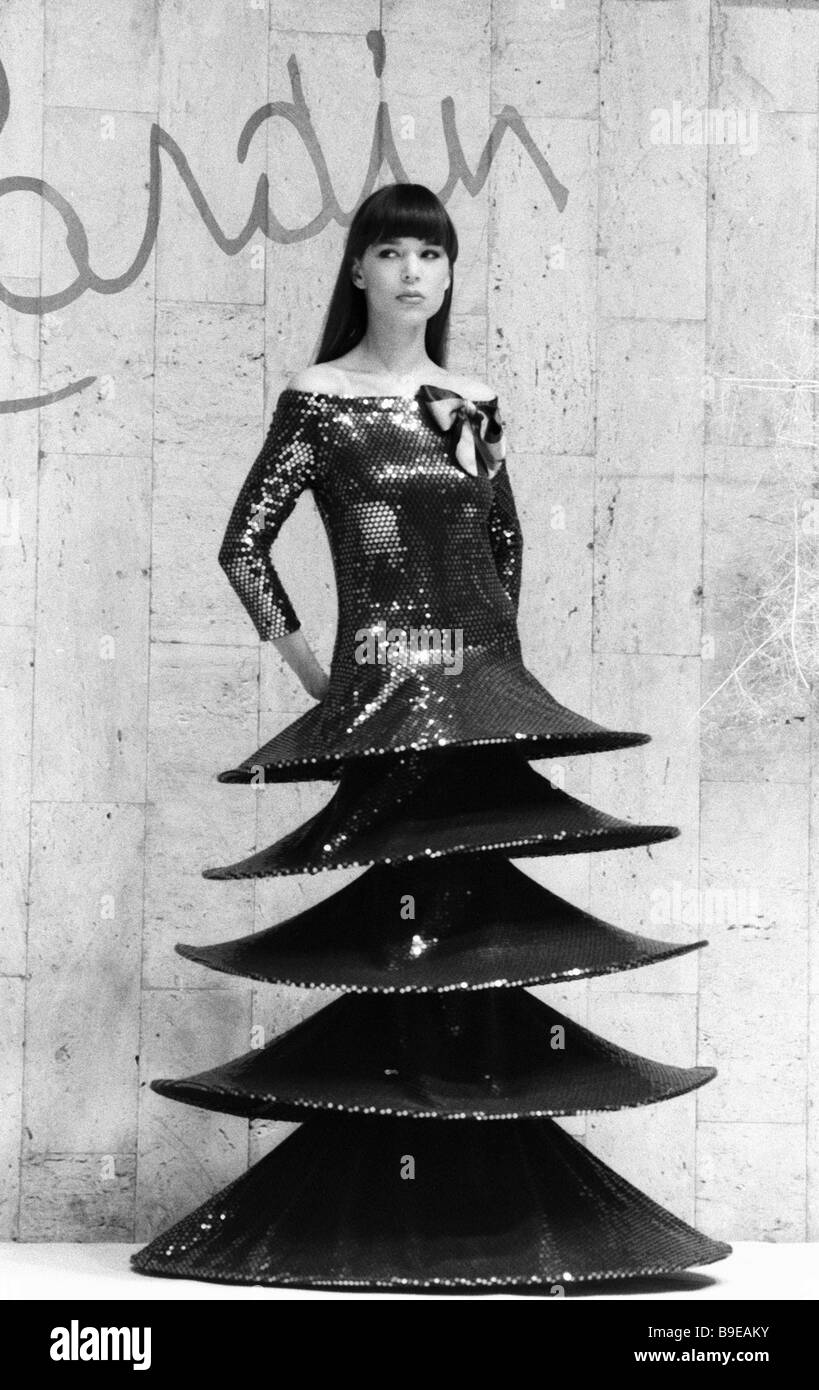 A model on the catwalk demonstrating an original dress from the latest ...
