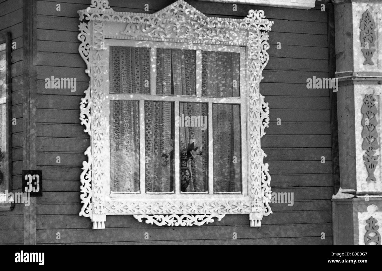 Carved window frames of a house in the village Sukhonoska Stock Photo ...