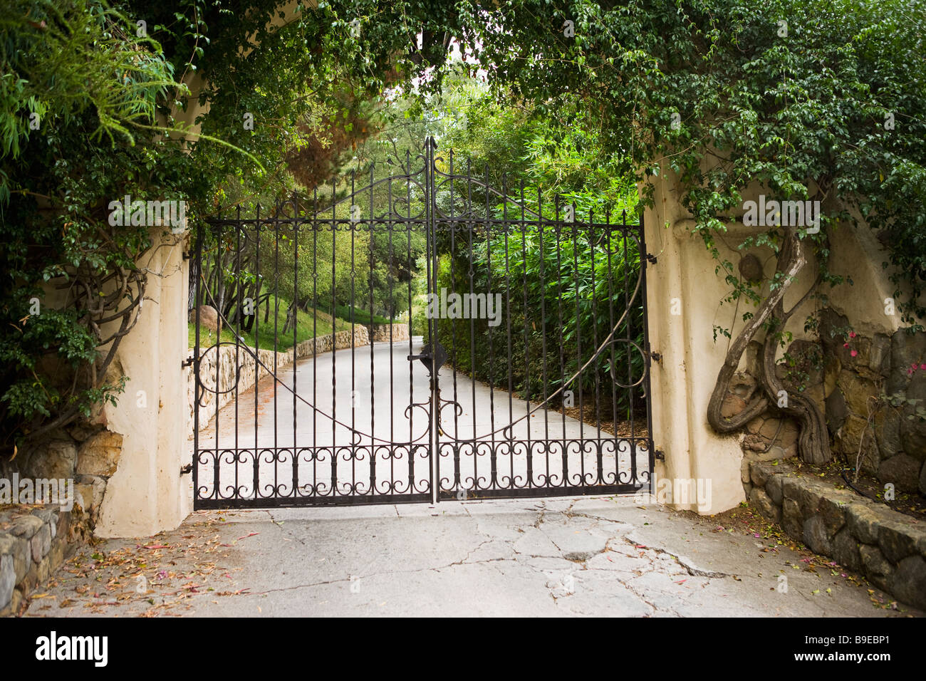 Large closed wrought iron gate Stock Photo - Alamy