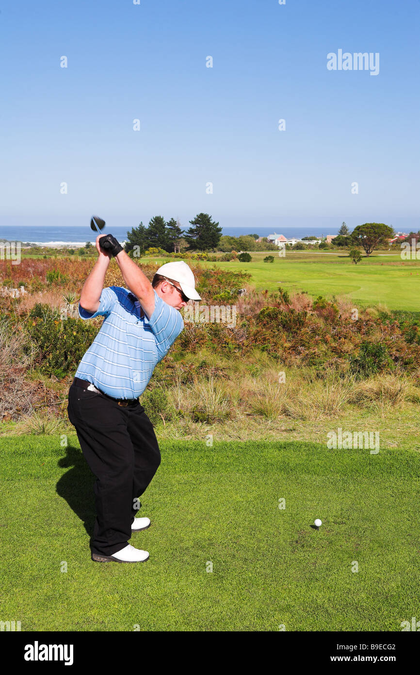 Man playing golf Stock Photo - Alamy