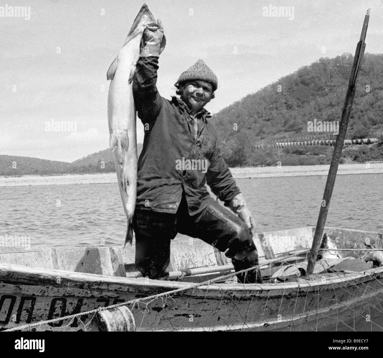 A fisherman showing his catch Stock Photo - Alamy