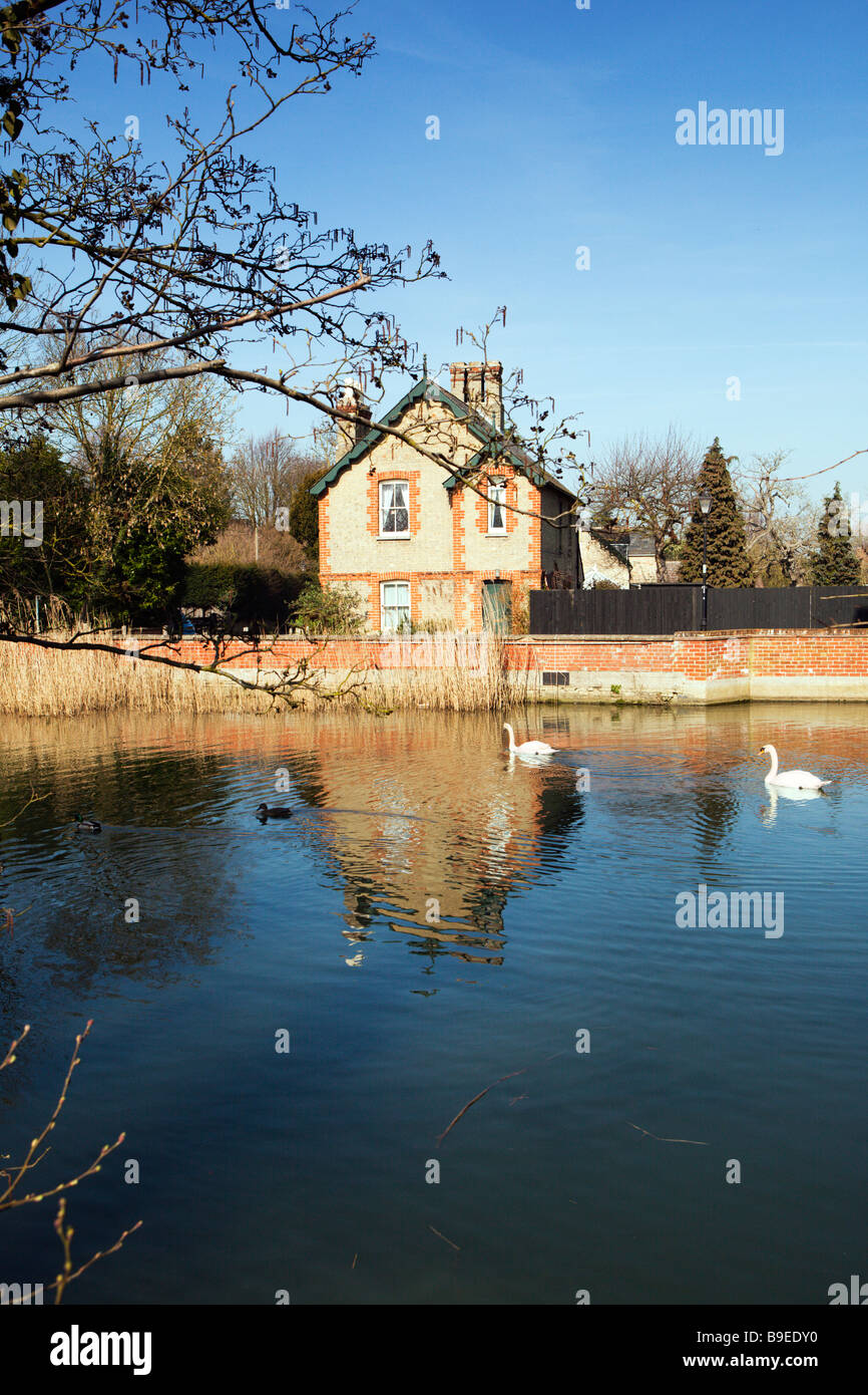 The River Ouse Reflection Of Picturesque Red Brick Cottage In Houghton ...