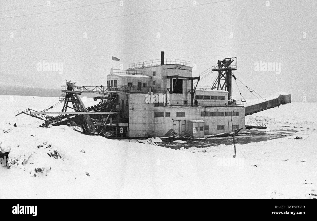 Gold extraction with a floating dredge Stock Photo - Alamy