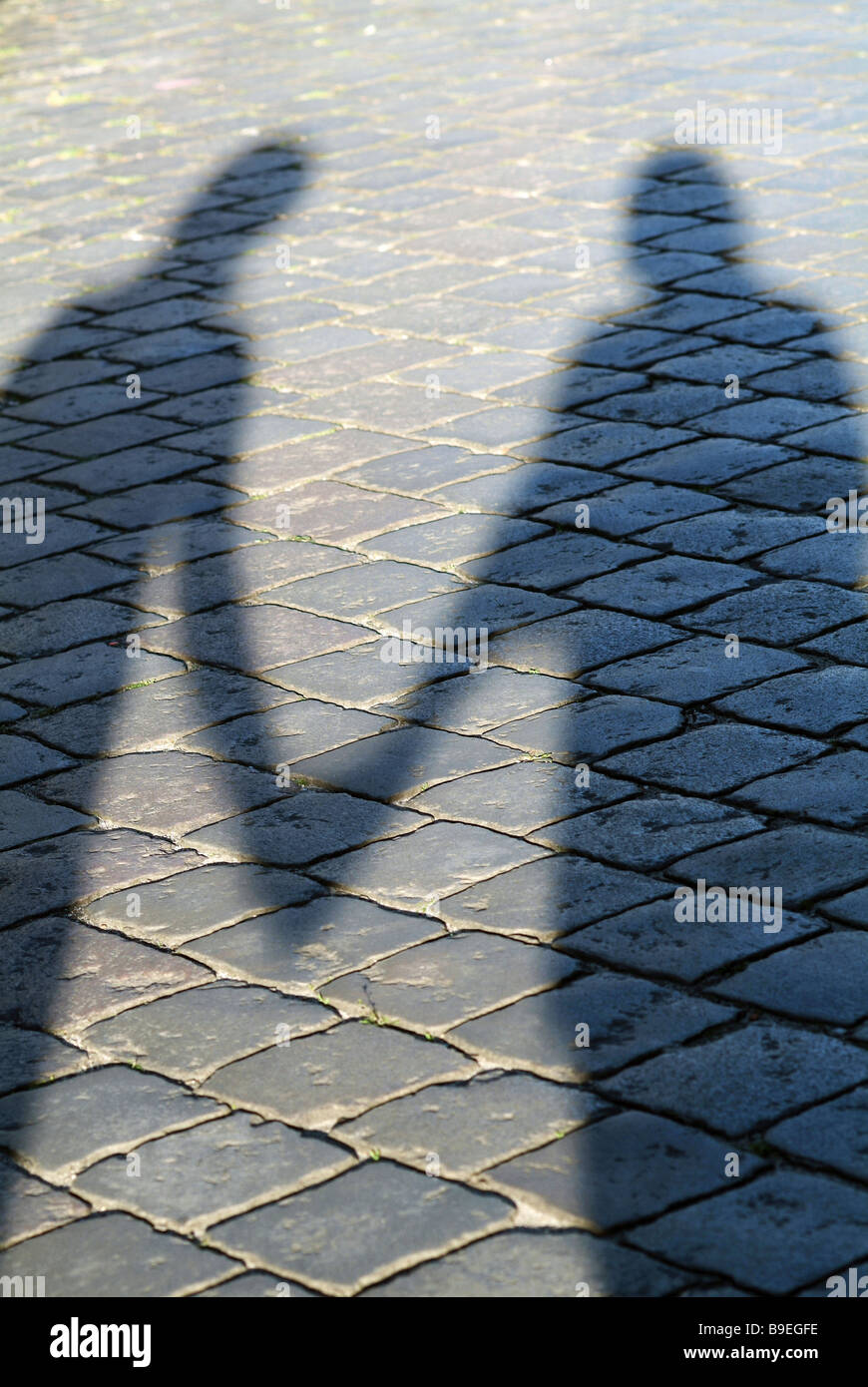 Shadows of two people holding hands Stock Photo - Alamy
