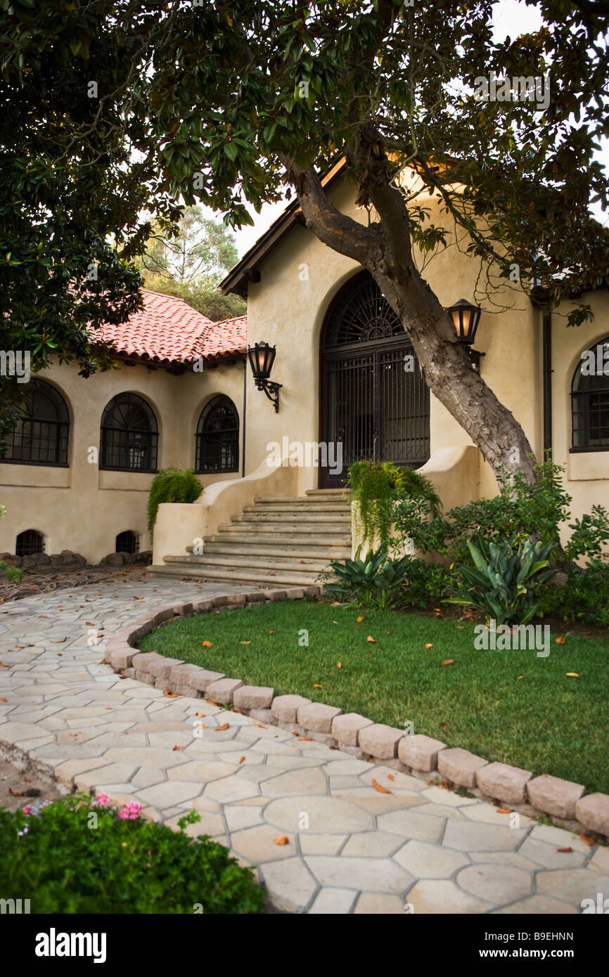 Pathway leading to entrance of old spanish home Stock Photo - Alamy