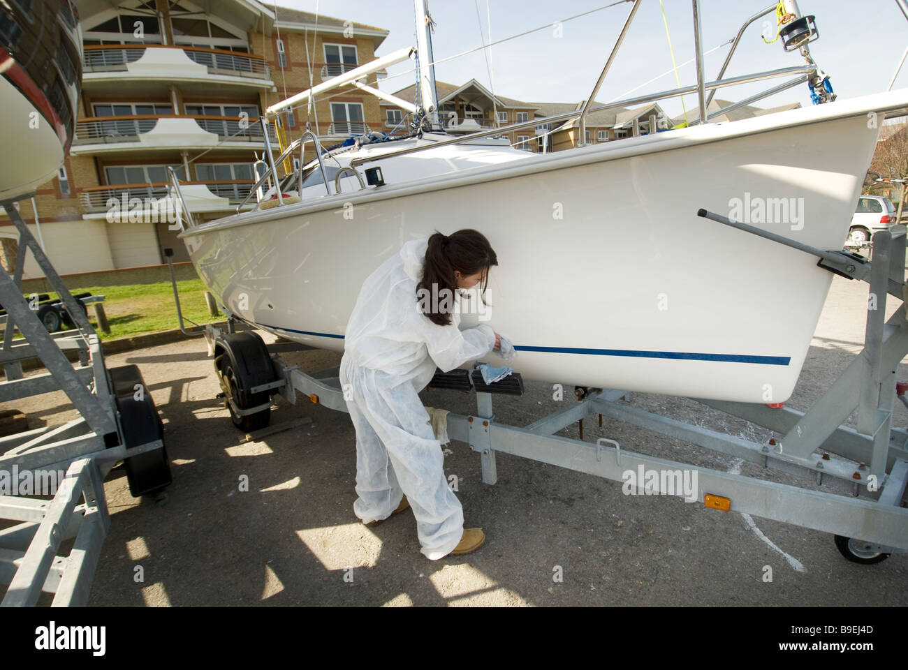 woman preparing a yacht for the sailing season Stock Photo - Alamy
