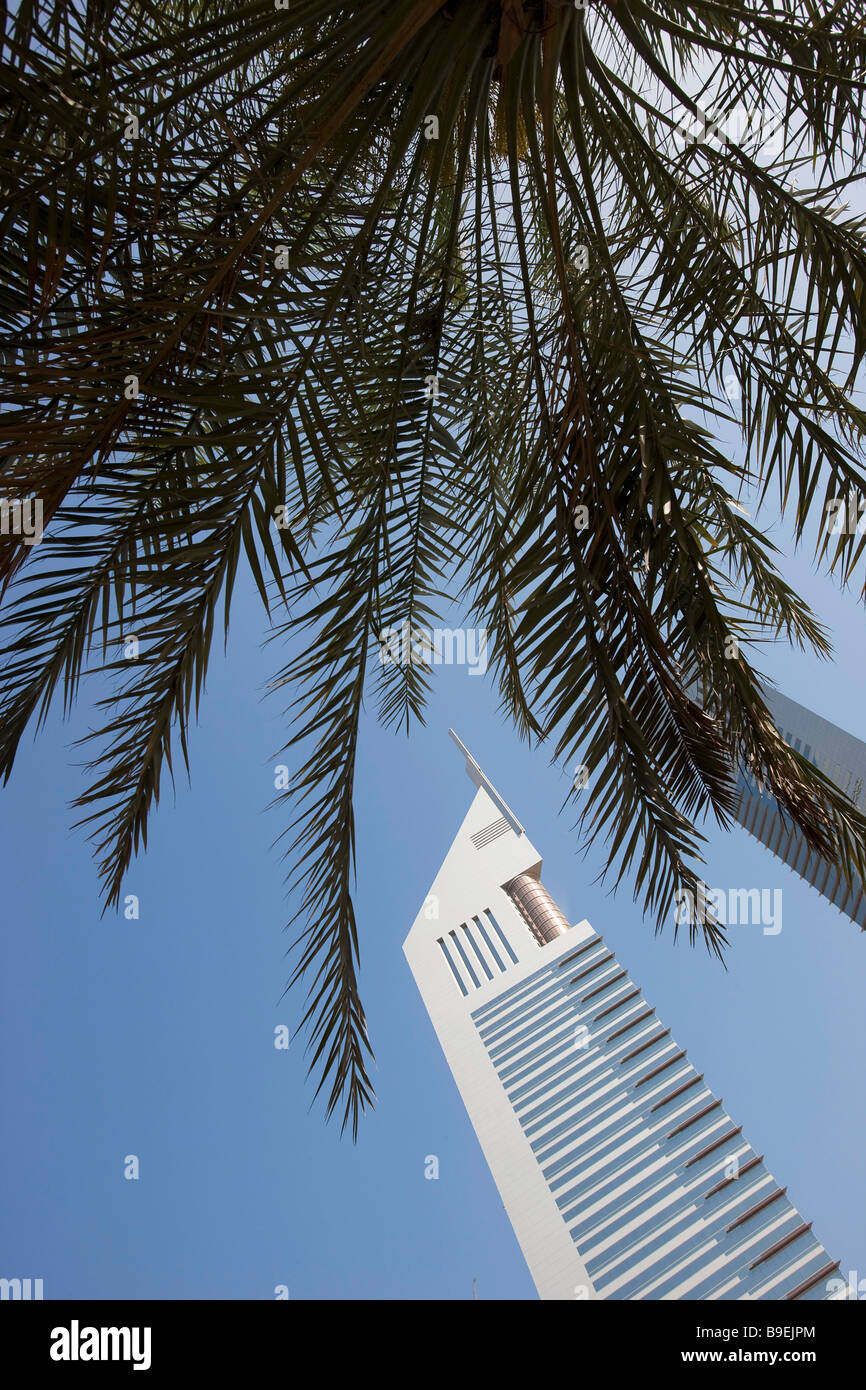 Emirates Twin Towers Dubai United Arab Emirates behind a Palm Tree ...